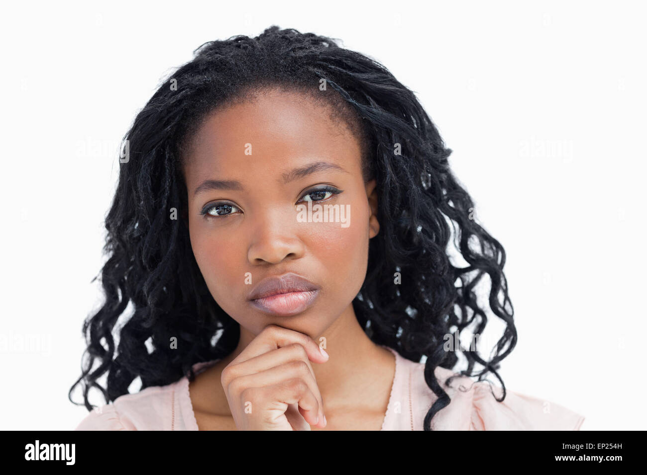 A woman staring at the camera resting her head on her hand Stock Photo ...
