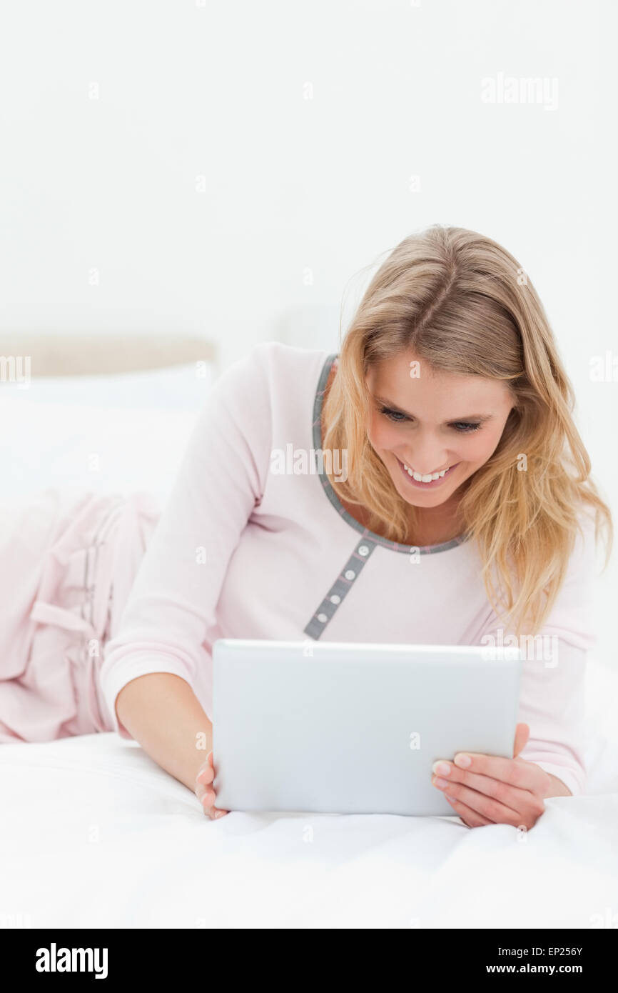 Woman laying across bed hi-res stock photography and images - Alamy