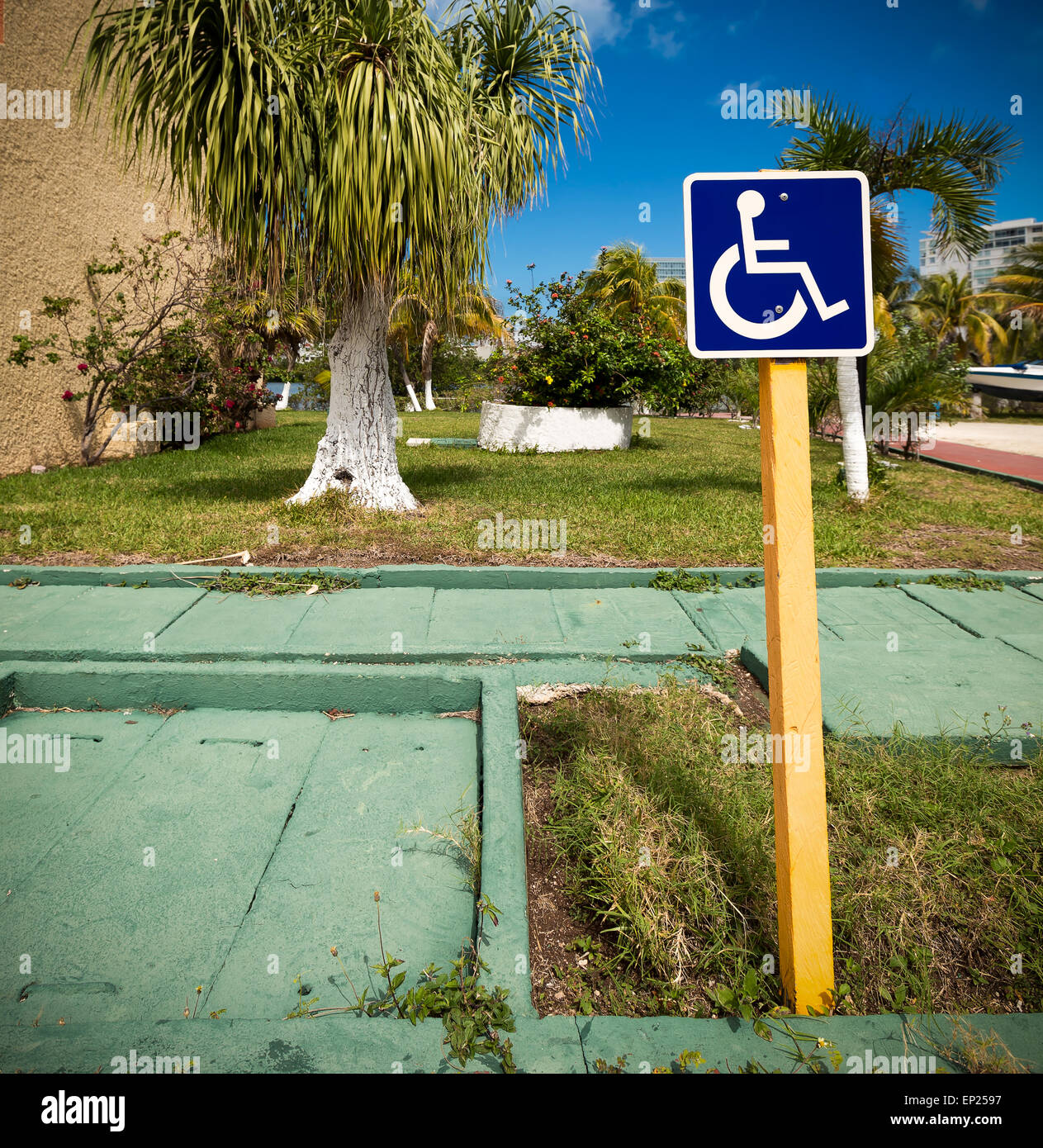 Blue handicapped sign with wheelchair, outdoors Stock Photo - Alamy