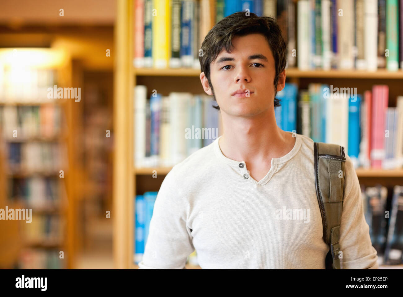 Good looking student standing up Stock Photo - Alamy