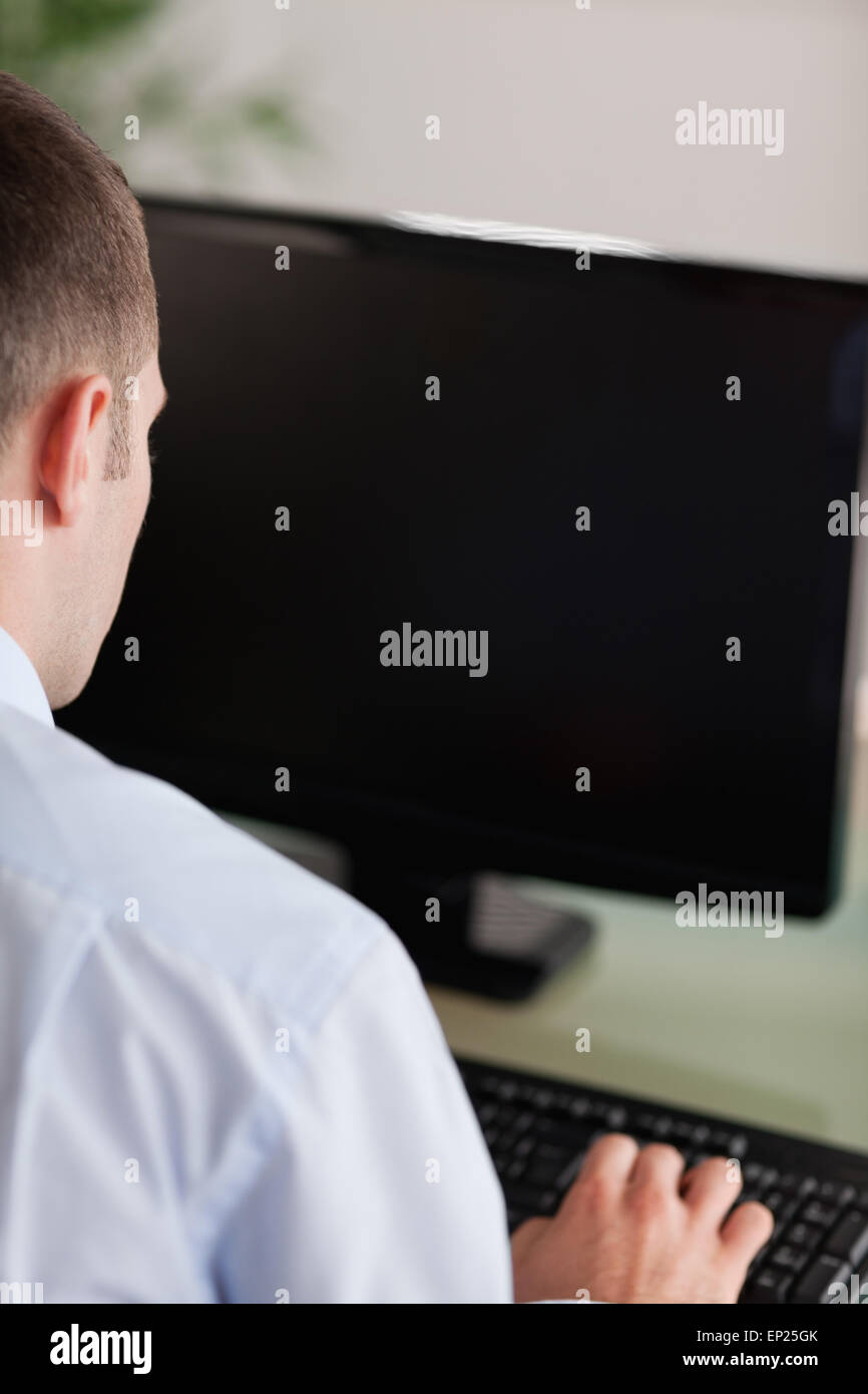 Close up of businessmans back working on his computer Stock Photo - Alamy