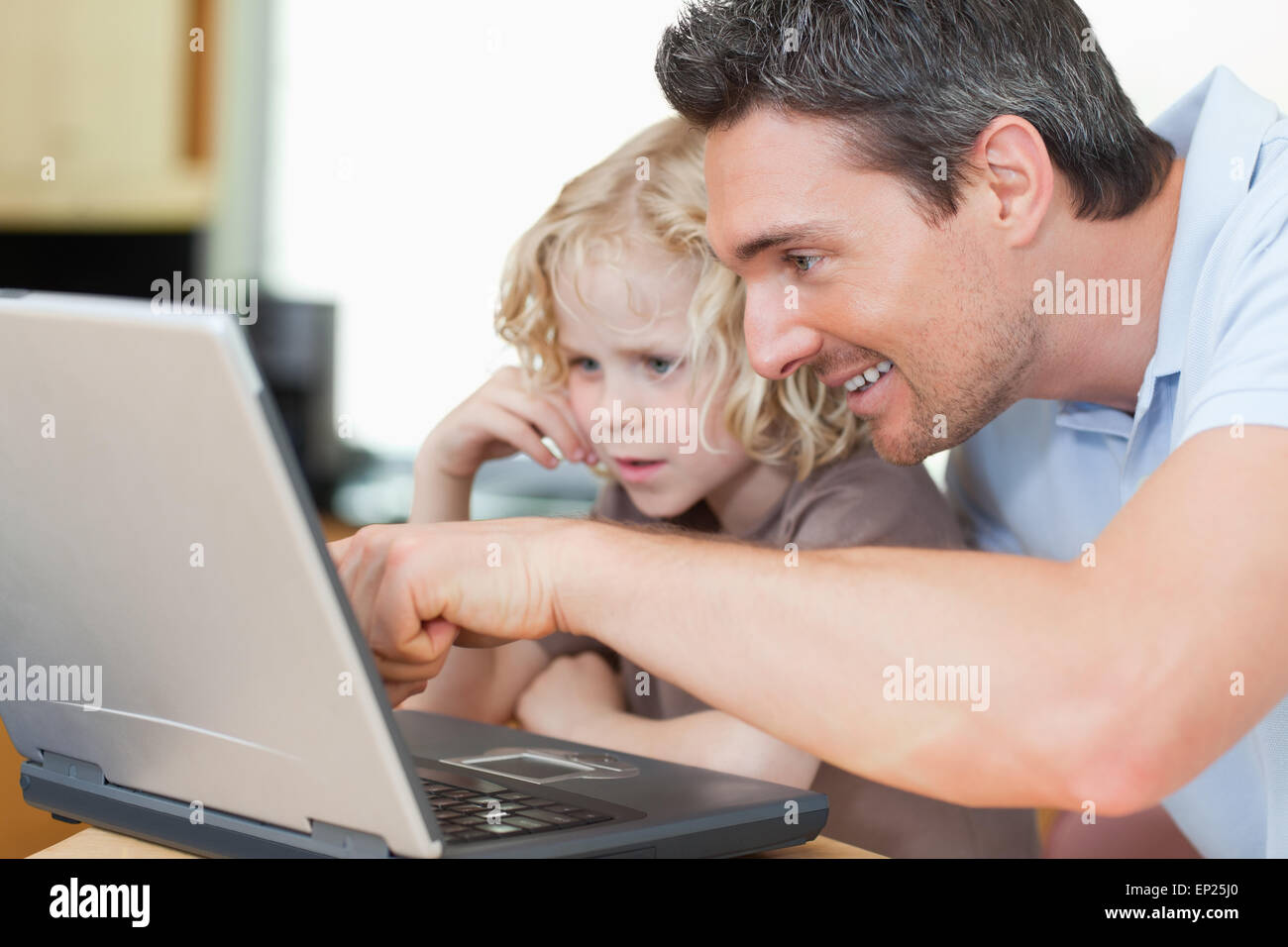 Father showing his son the internet Stock Photo - Alamy