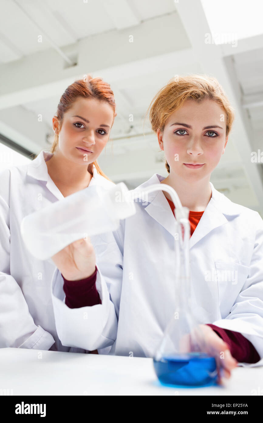 Lab partners doing experiment hi-res stock photography and images - Alamy