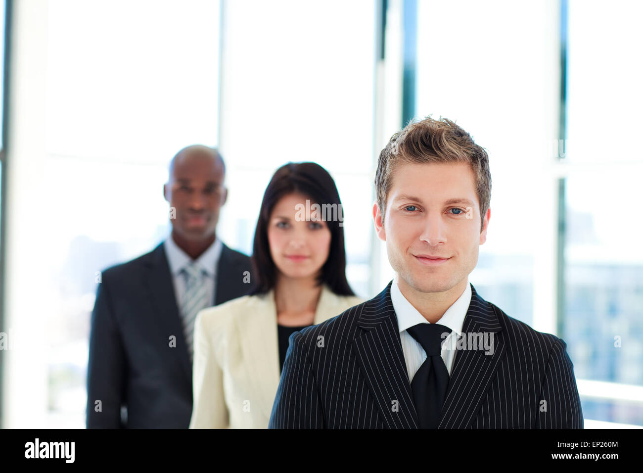 Young businessman leading his team Stock Photo - Alamy