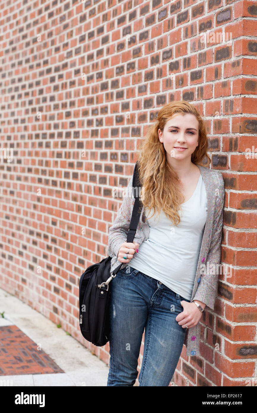 Portrait of a cute student standing up Stock Photo - Alamy