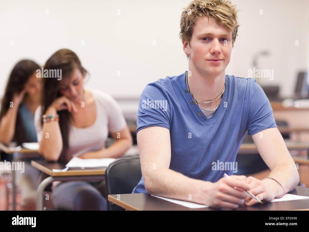 Young students doing an assignment Stock Photo - Alamy