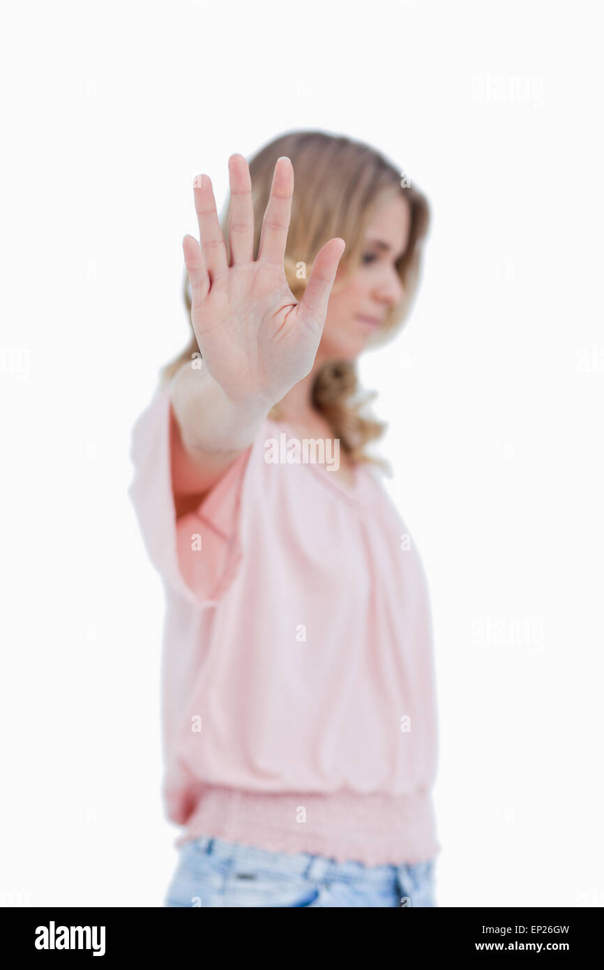 Side view of a woman with her hand held up to the camera Stock Photo ...