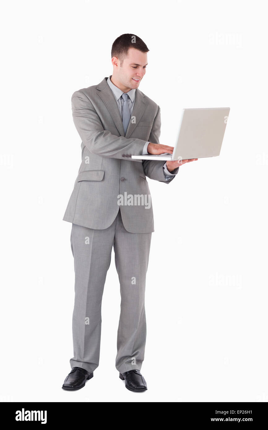 Portrait of a businessman using a laptop Stock Photo - Alamy