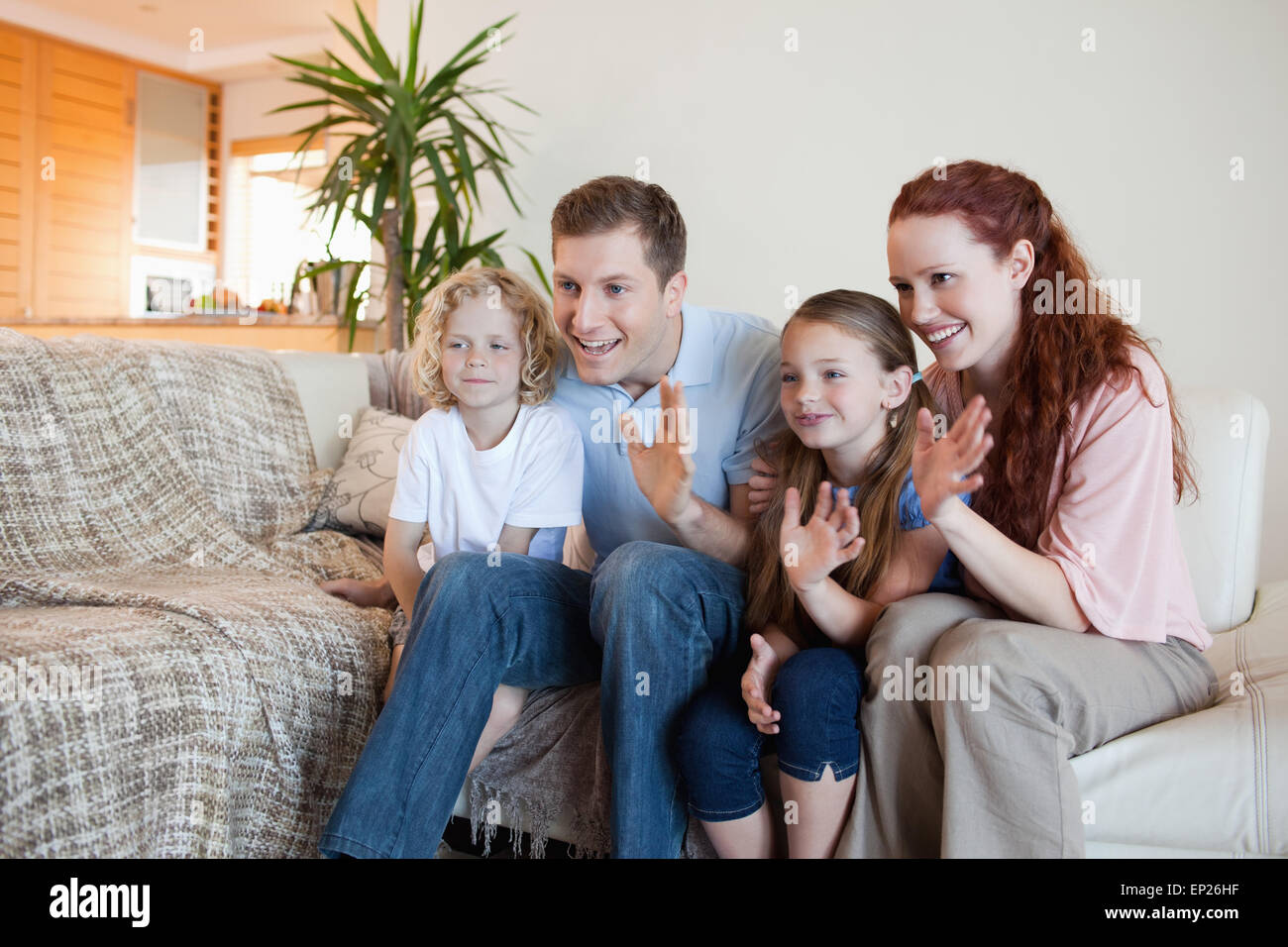 Family waving their hands Stock Photo - Alamy