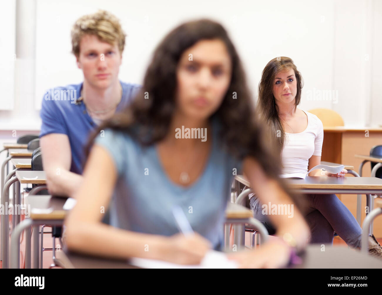 Serious students taking notes Stock Photo - Alamy