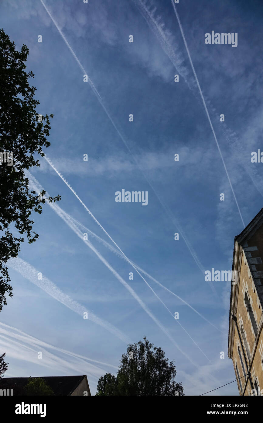 Multiple jet contrails in a vivid blue sky Stock Photo - Alamy