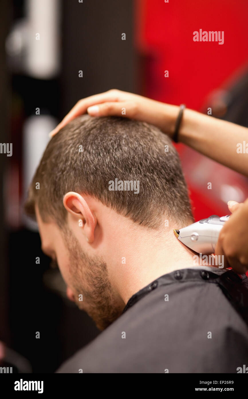 Portrait of a male young student having a haircut Stock Photo - Alamy