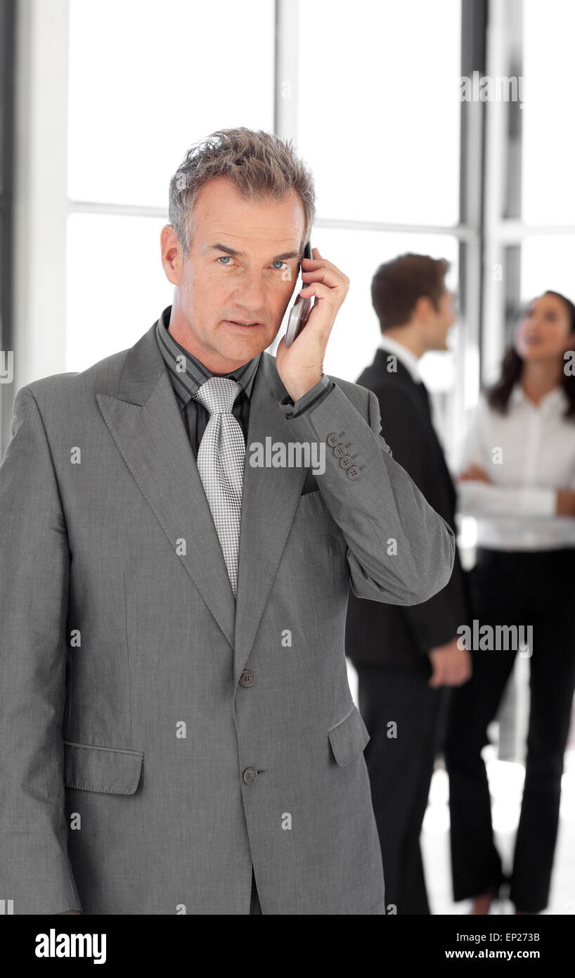 Senior Businessman talking on cellphone Stock Photo - Alamy