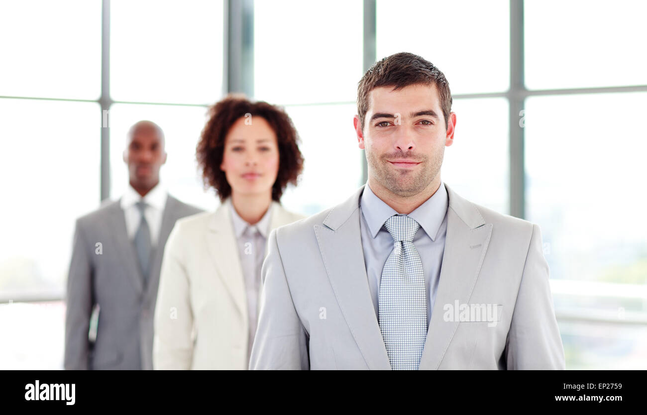 Serious businessman leading his colleagues Stock Photo - Alamy