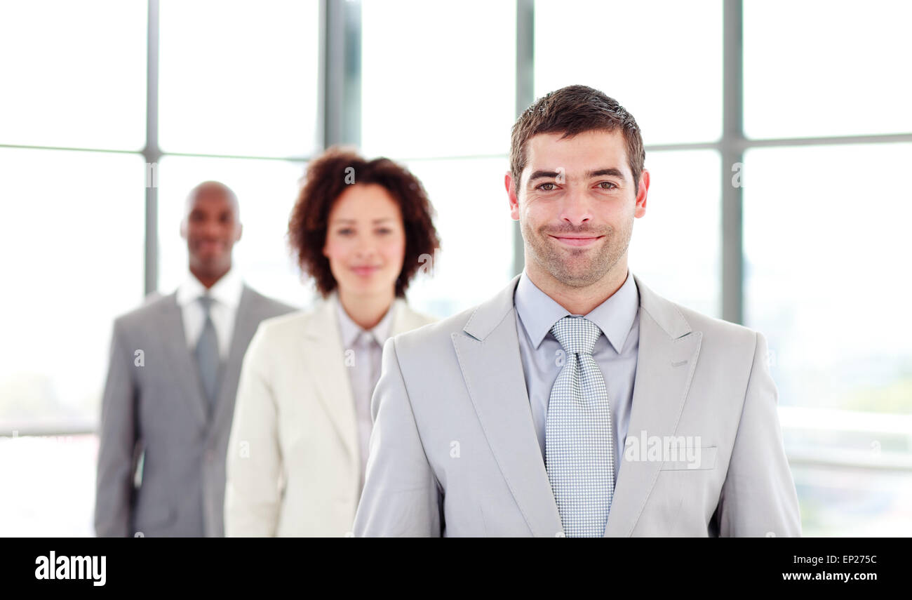 Attractive businessman leading his colleagues Stock Photo - Alamy