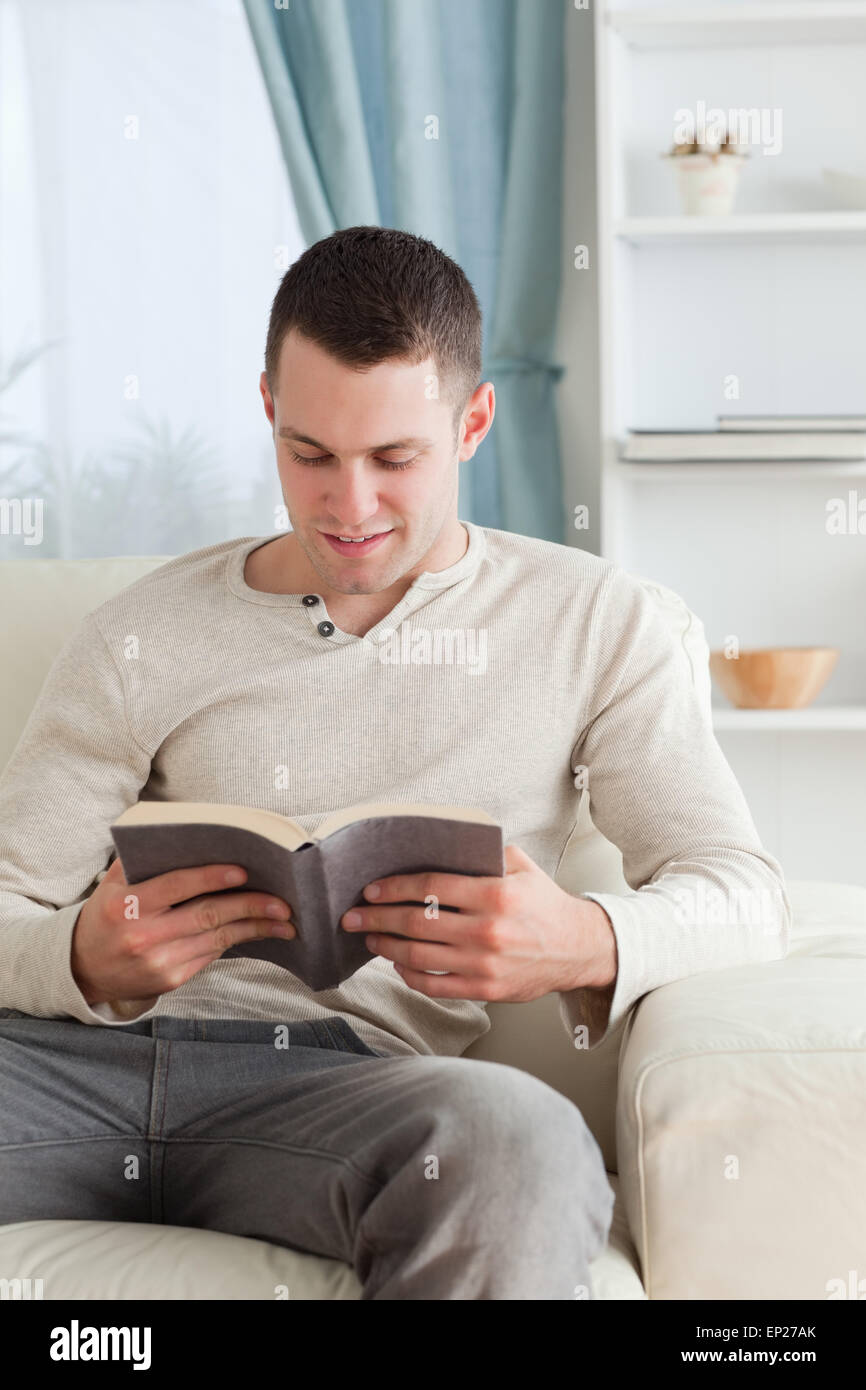 Portrait of a man reading a book Stock Photo - Alamy