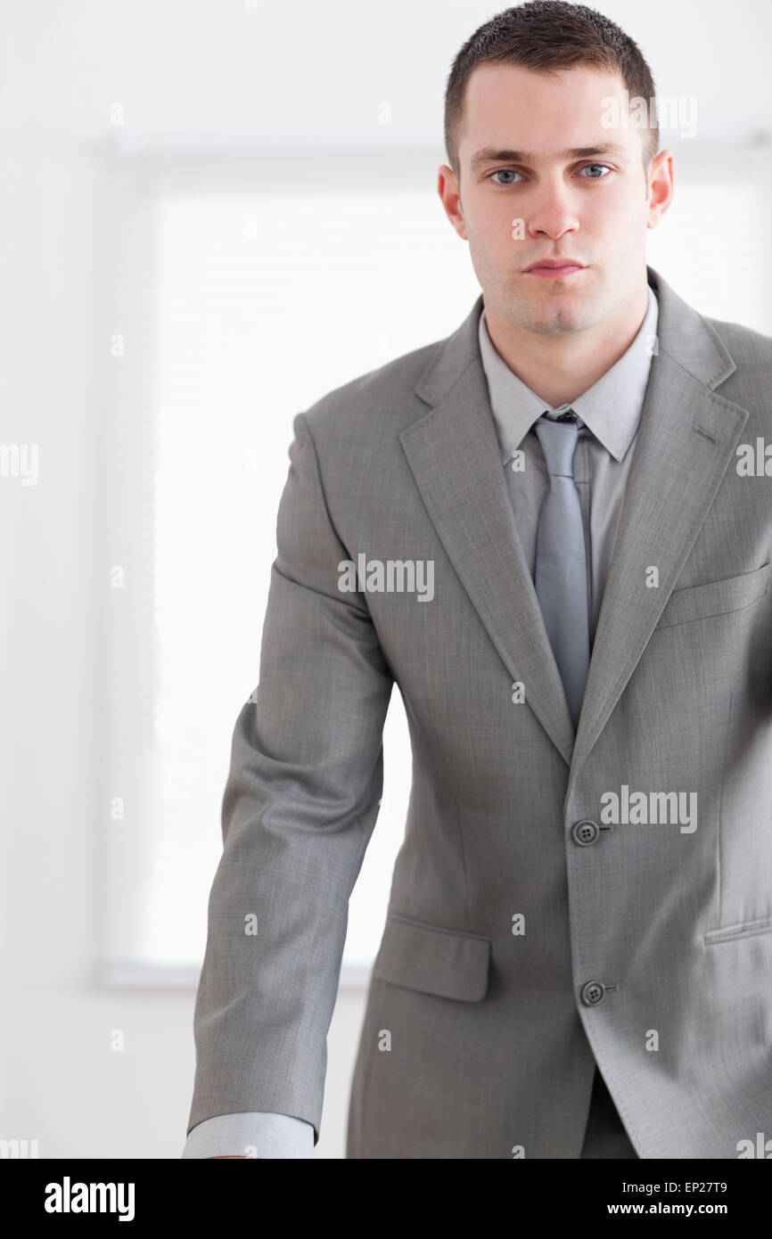 Confident business man waiting Stock Photo - Alamy