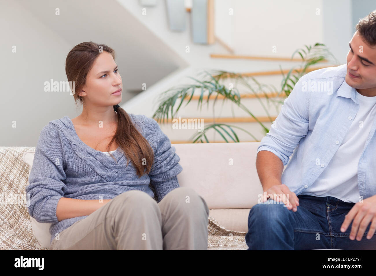 Couple talking seriously Stock Photo - Alamy