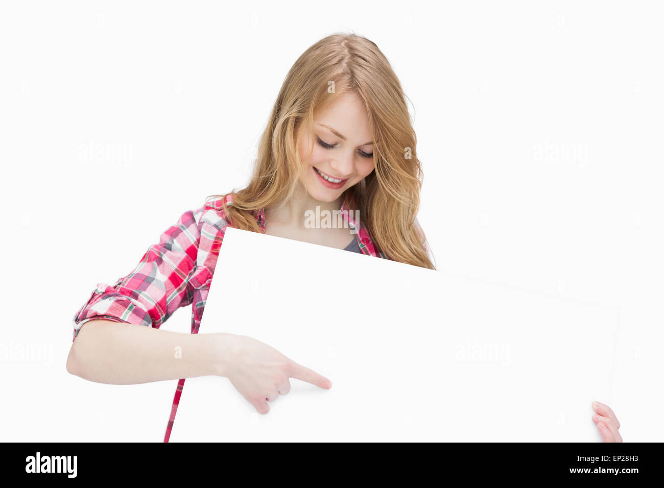 Woman looking at a blank board while showing it Stock Photo - Alamy