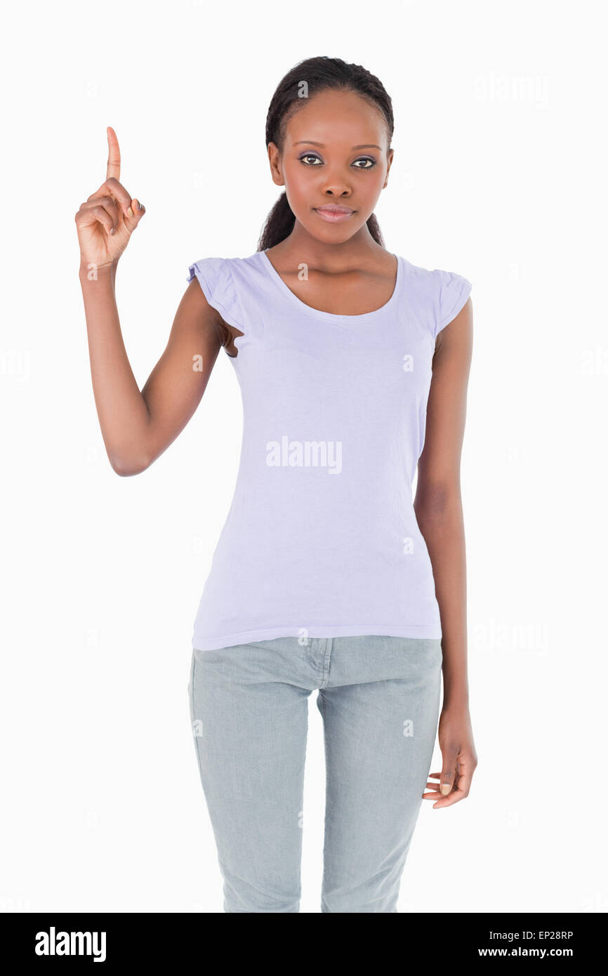 Close up of woman pointing up on white background Stock Photo - Alamy