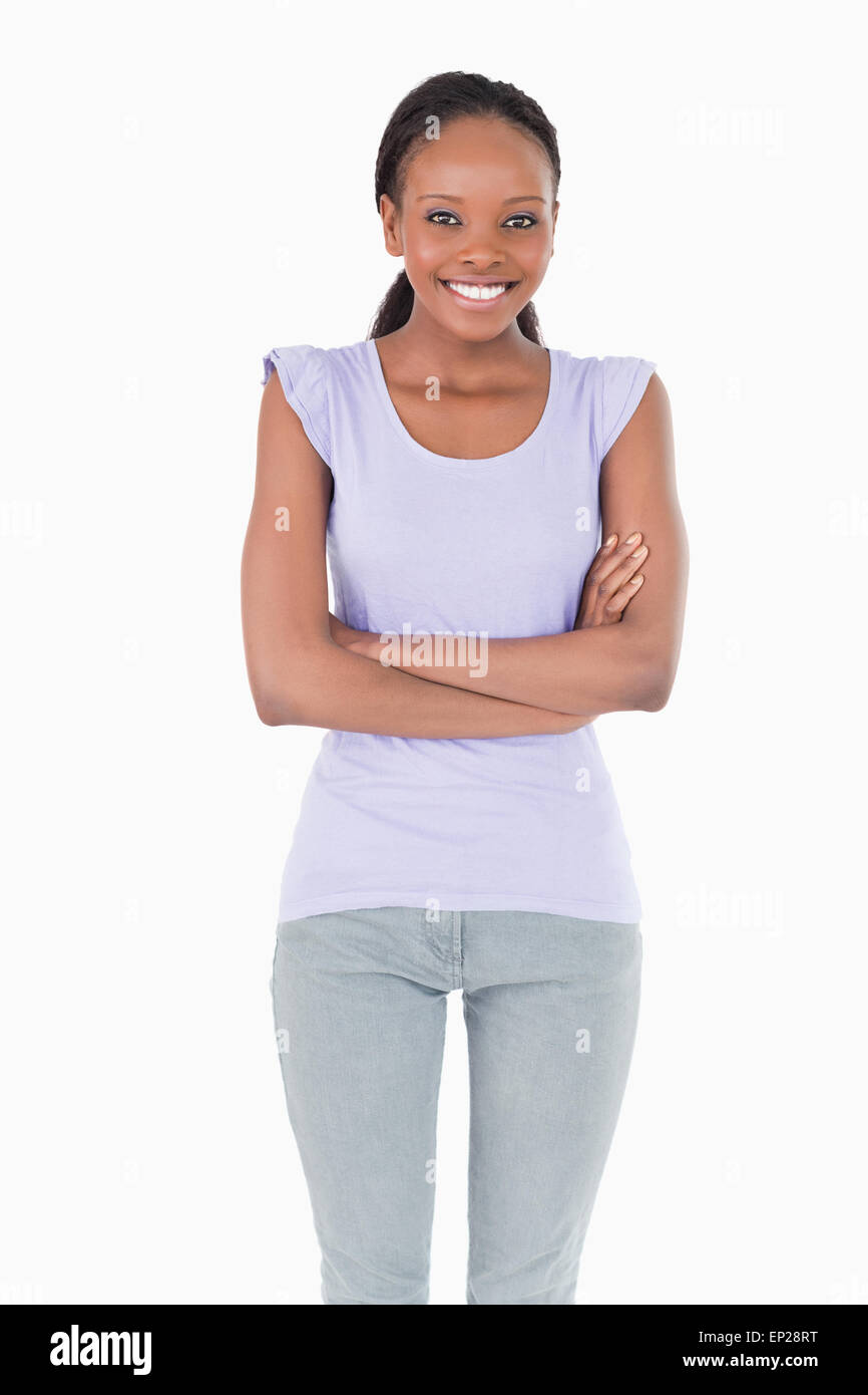 Close up of woman with arms folded on white background Stock Photo - Alamy