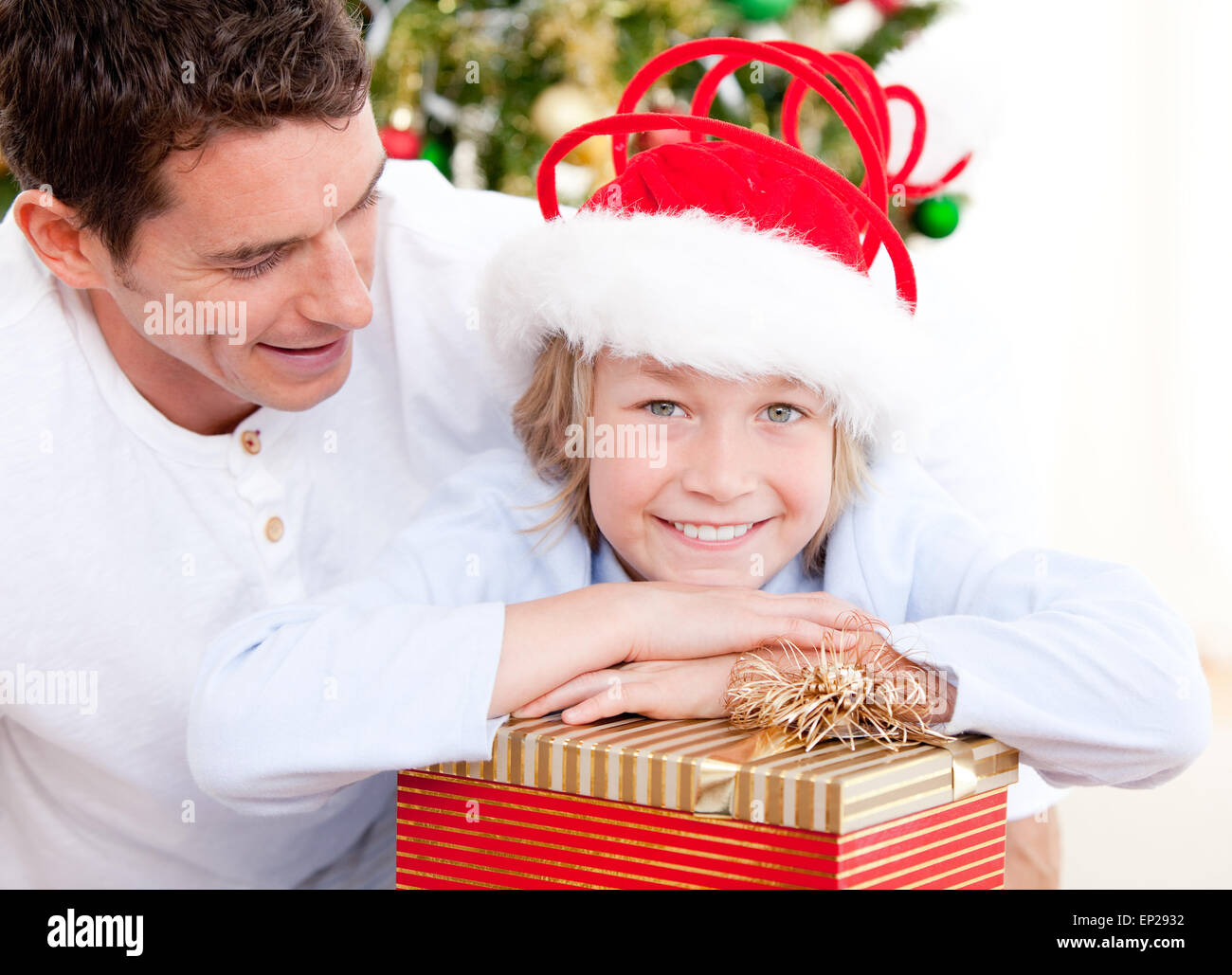 Handsome father celebrating christmas with his son Stock Photo - Alamy