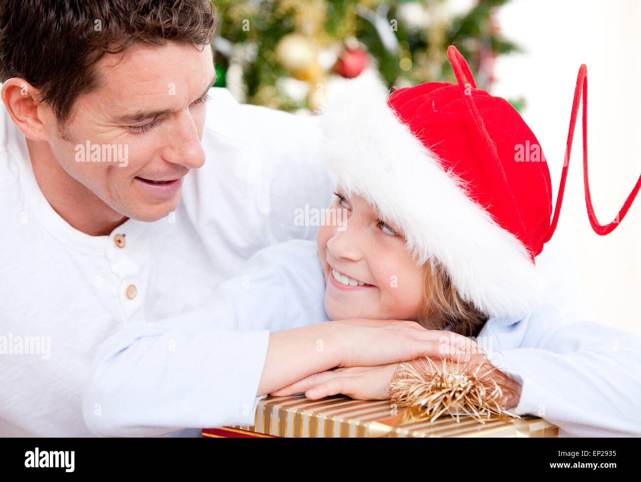 Attractive father celebrating christmas with his son Stock Photo - Alamy