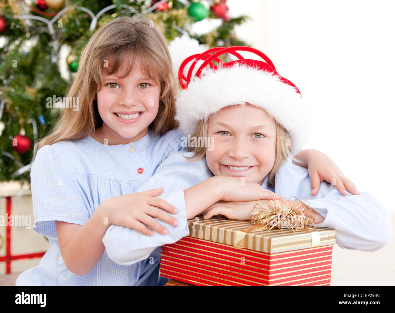 Adorable childrens celebrating christmas Stock Photo - Alamy