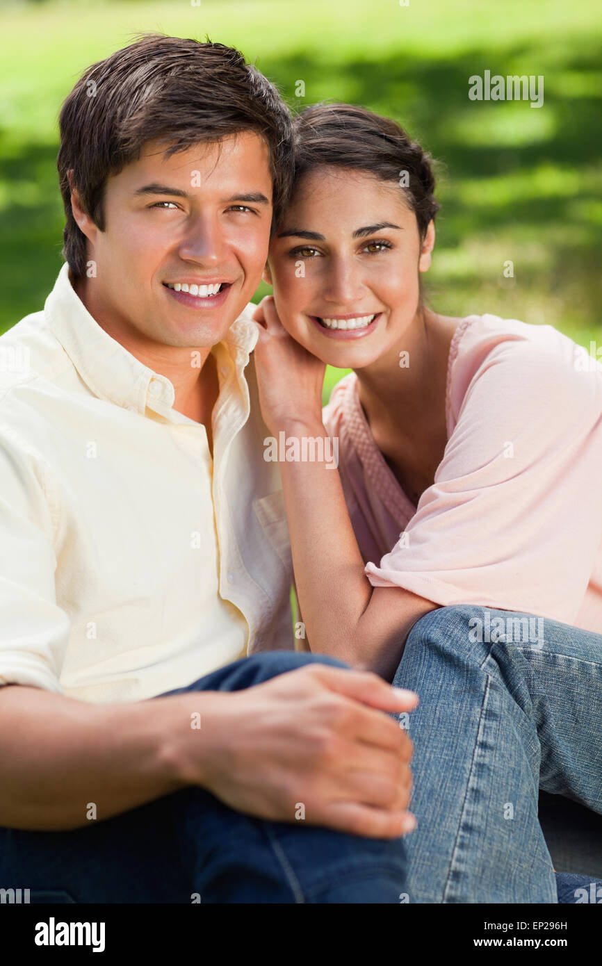 Woman leaning on her friend's shoulder while sitting with him Stock ...