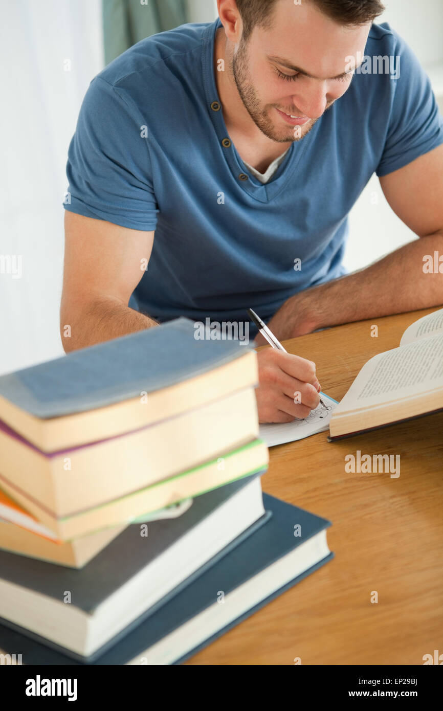 Smiling student doing book report Stock Photo - Alamy