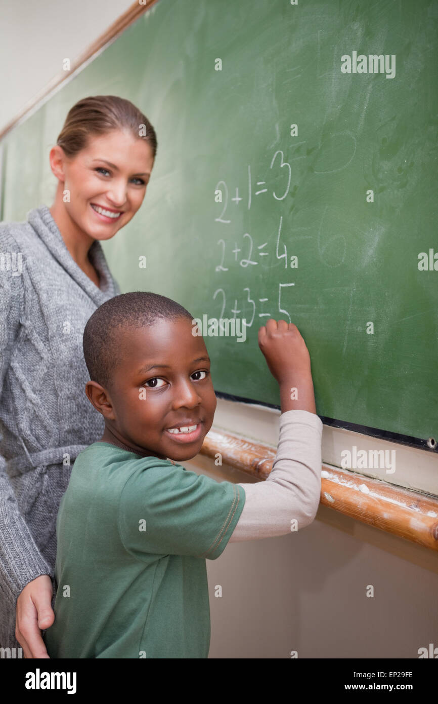 Portrait of a teacher explaining mathematics to a pupil Stock Photo - Alamy