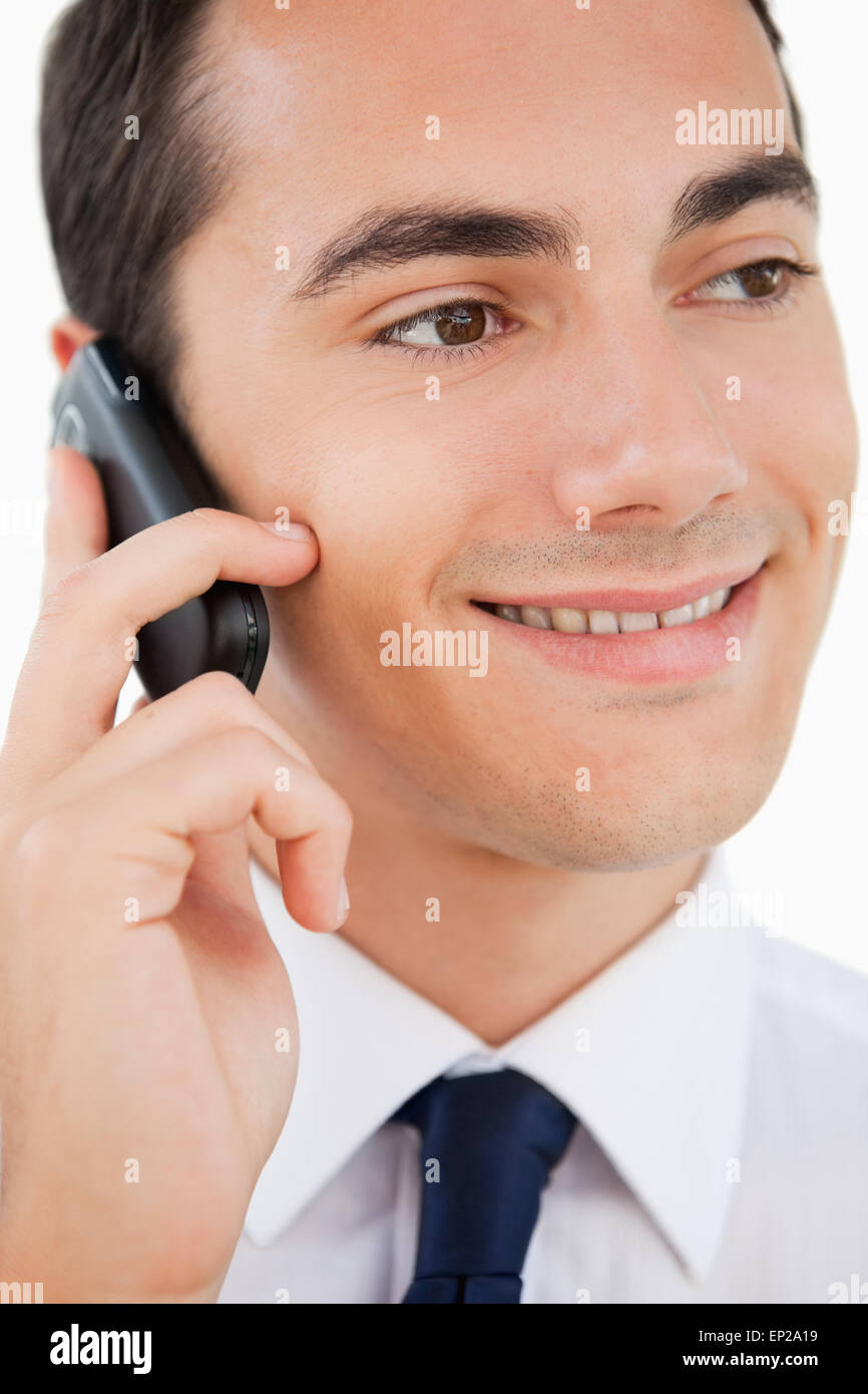 Close-up of a smiling man in a suit using his cellphone Stock Photo - Alamy