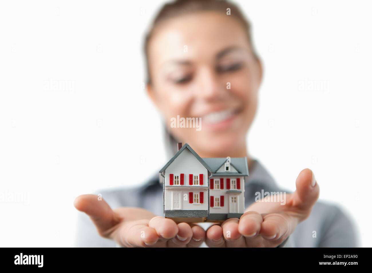 Close up of model house being held by female estate agent Stock Photo ...