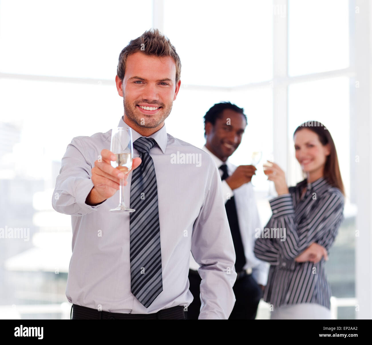 Handsome businessman celebrating a success Stock Photo - Alamy