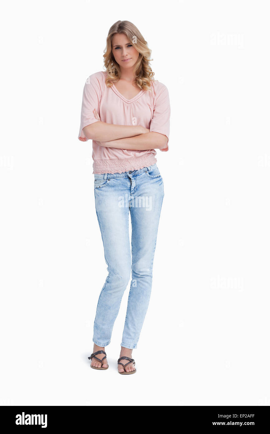 A serious woman standing with her arms folded Stock Photo - Alamy