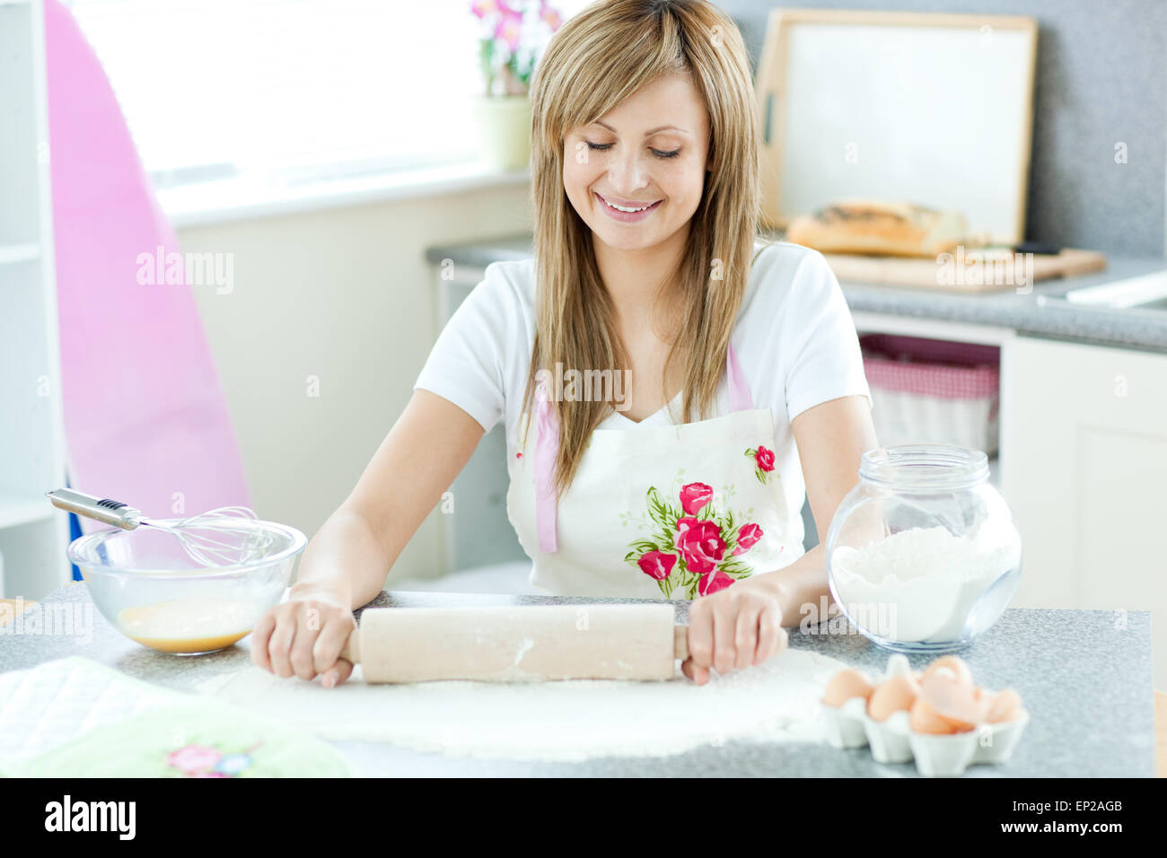Portrait of an attractive woman preparing a cake in the kitchen Stock ...
