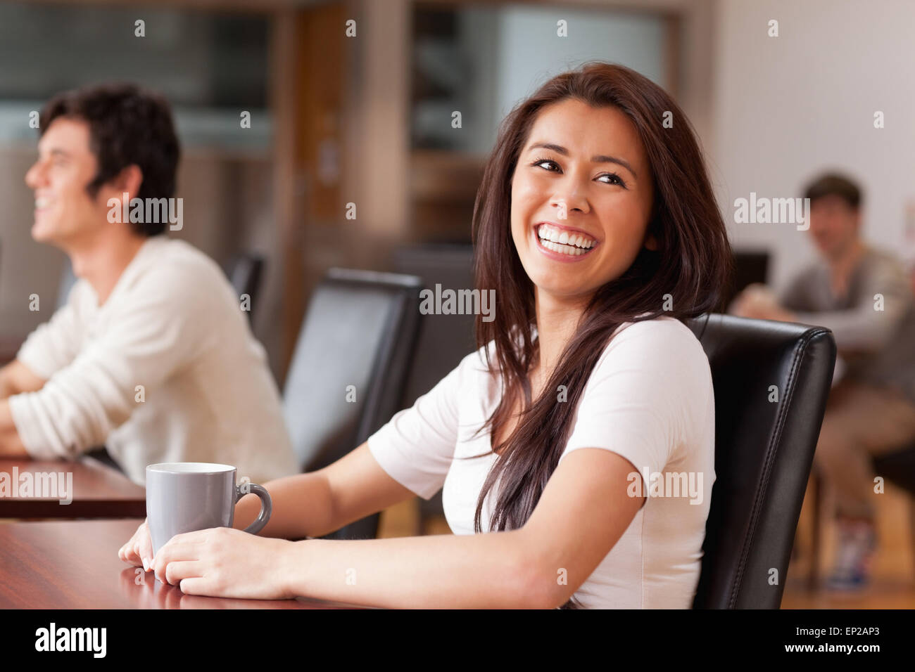 Laughing woman having a tea Stock Photo - Alamy
