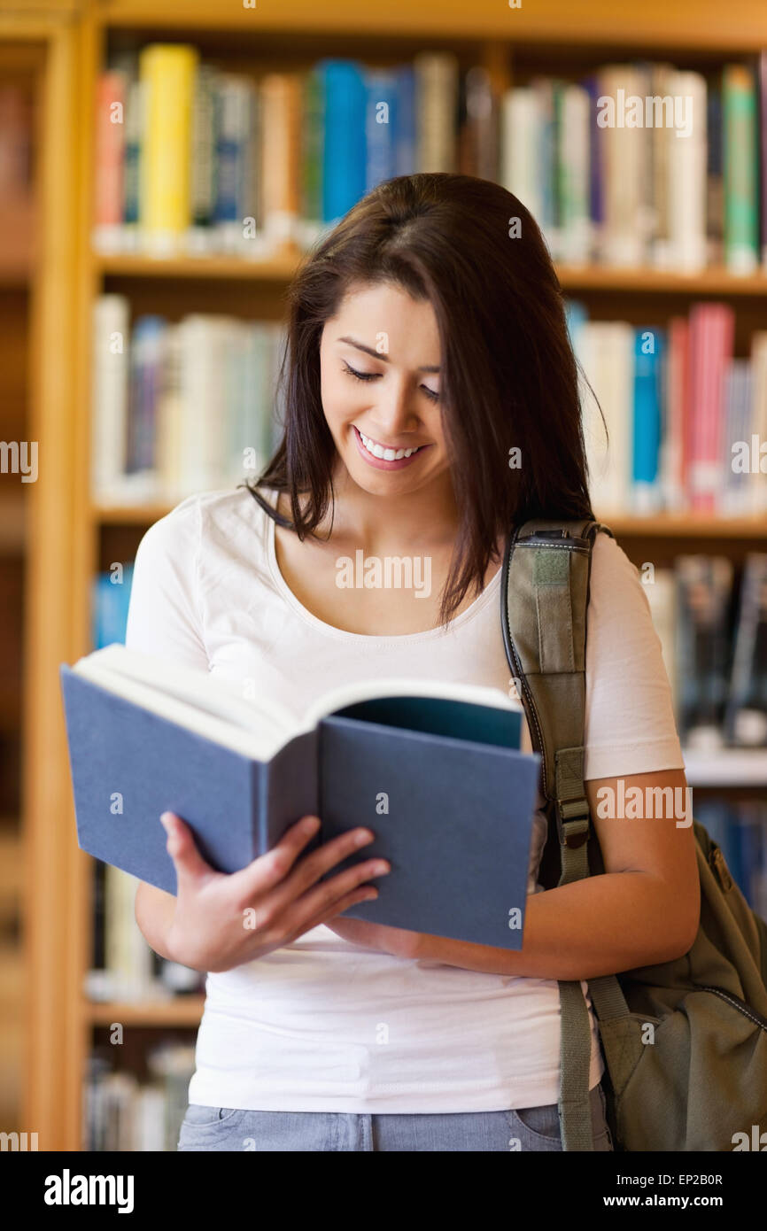 Portrait of a beautiful student reading a book Stock Photo - Alamy