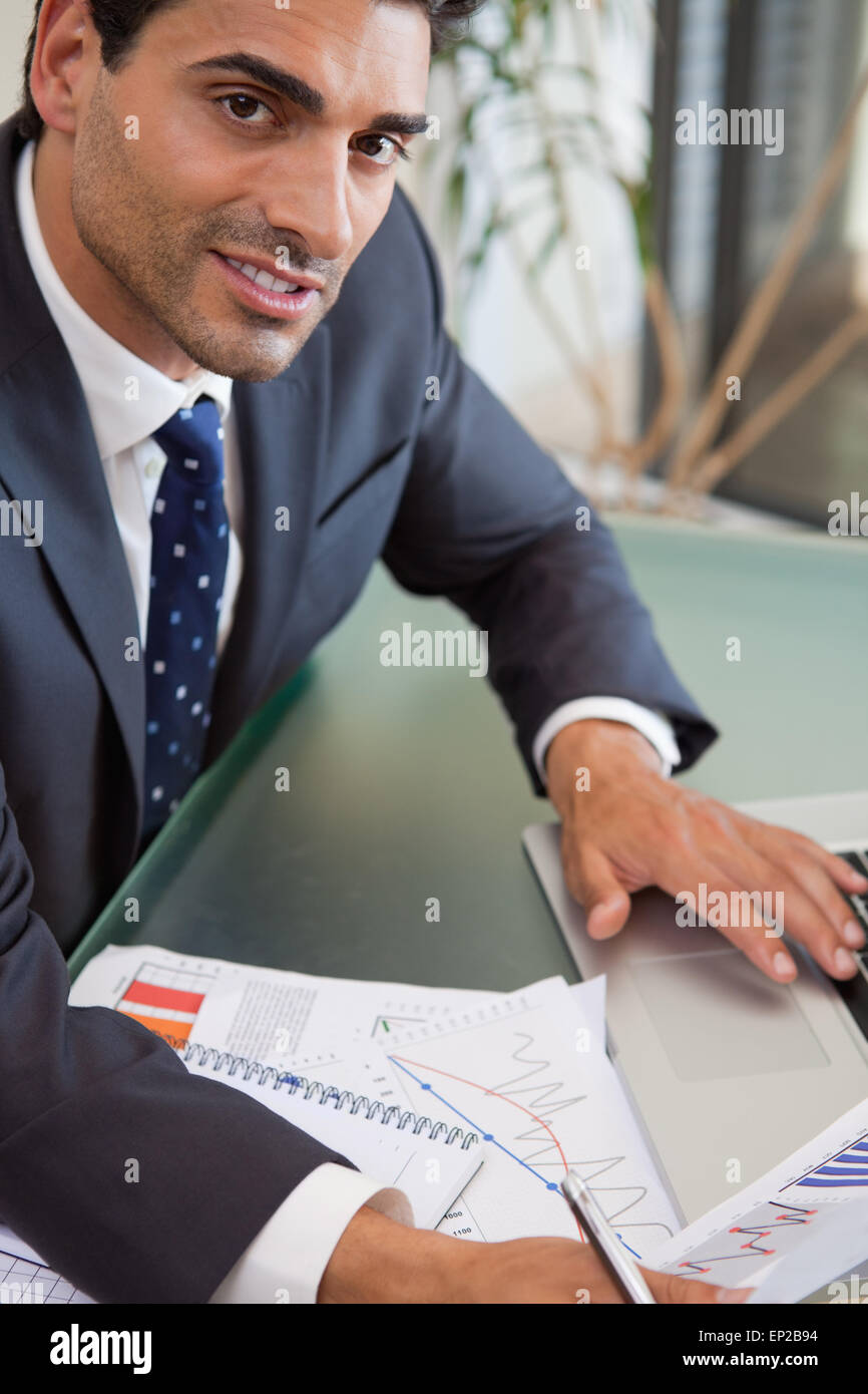 Portrait of a focused sales person studying statistics Stock Photo - Alamy