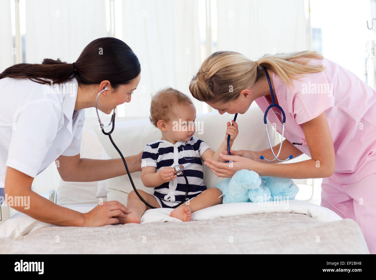 Baby playing with stethoscopes Stock Photo - Alamy
