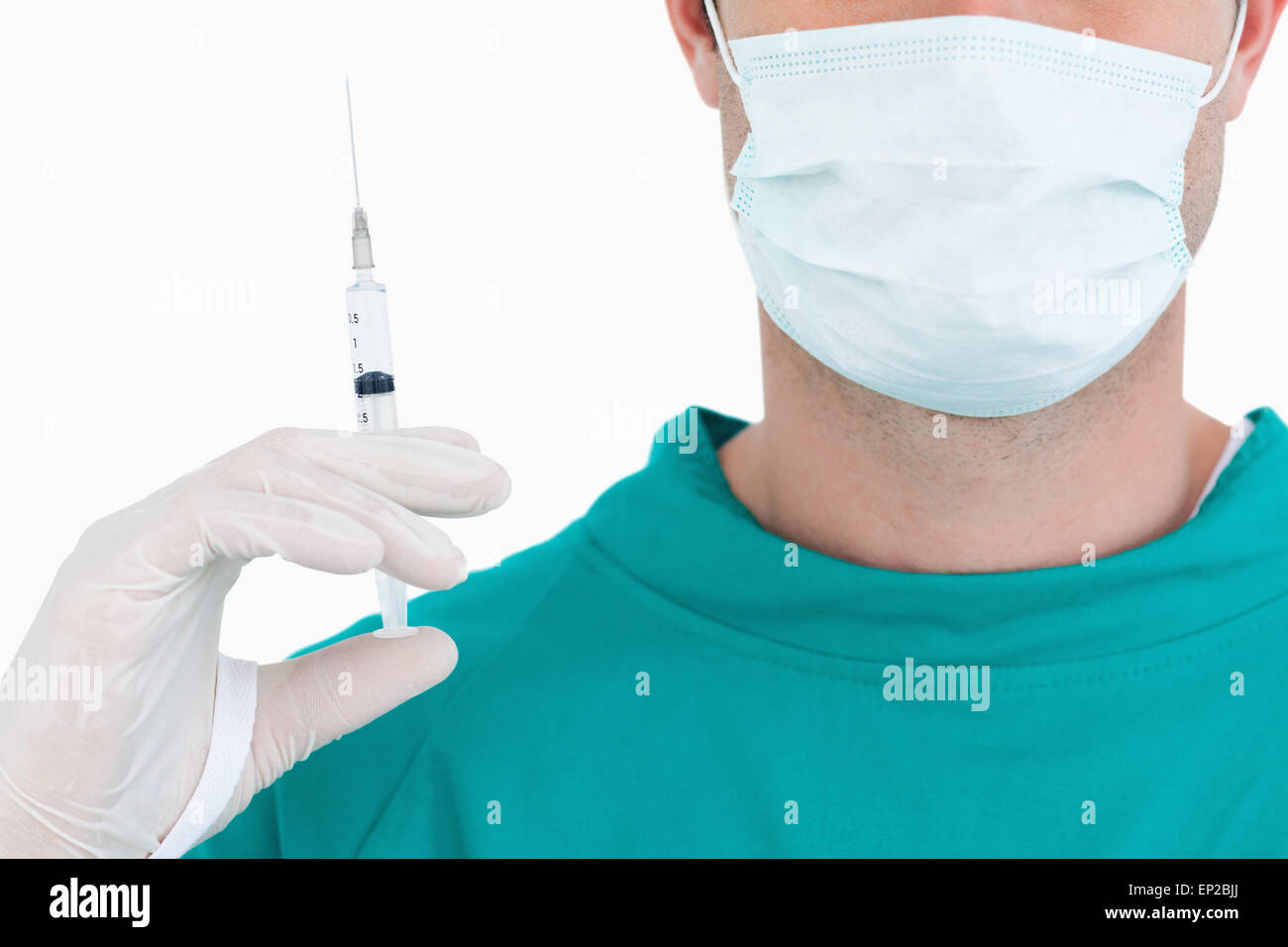 Close up of doctor with syringe wearing scrubs Stock Photo - Alamy