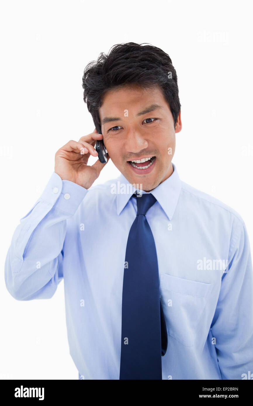 Portrait of a surprised businessman making a phone call Stock Photo - Alamy