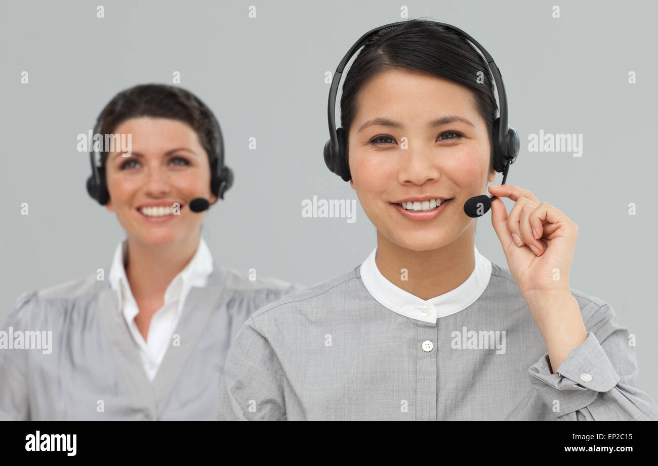 Female Customer service agents with headset on Stock Photo - Alamy