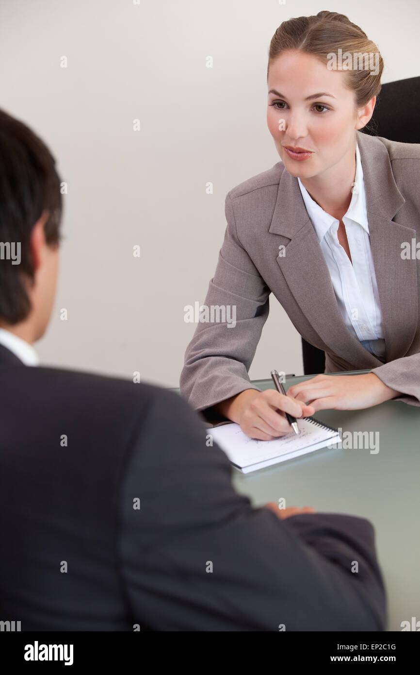 Portrait of a serious manager interviewing a male applicant Stock Photo ...