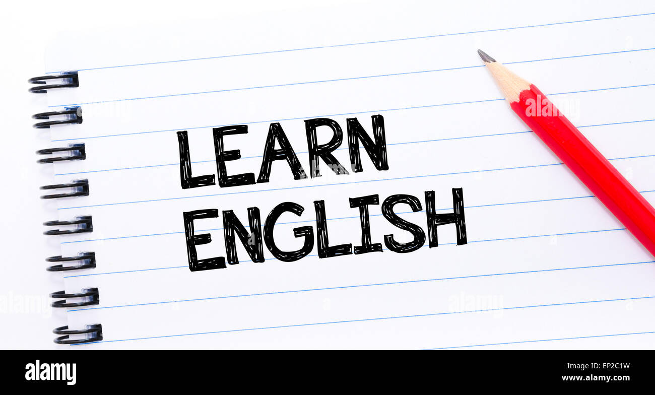 Learn English Text written on notebook page, red pencil on the right ...