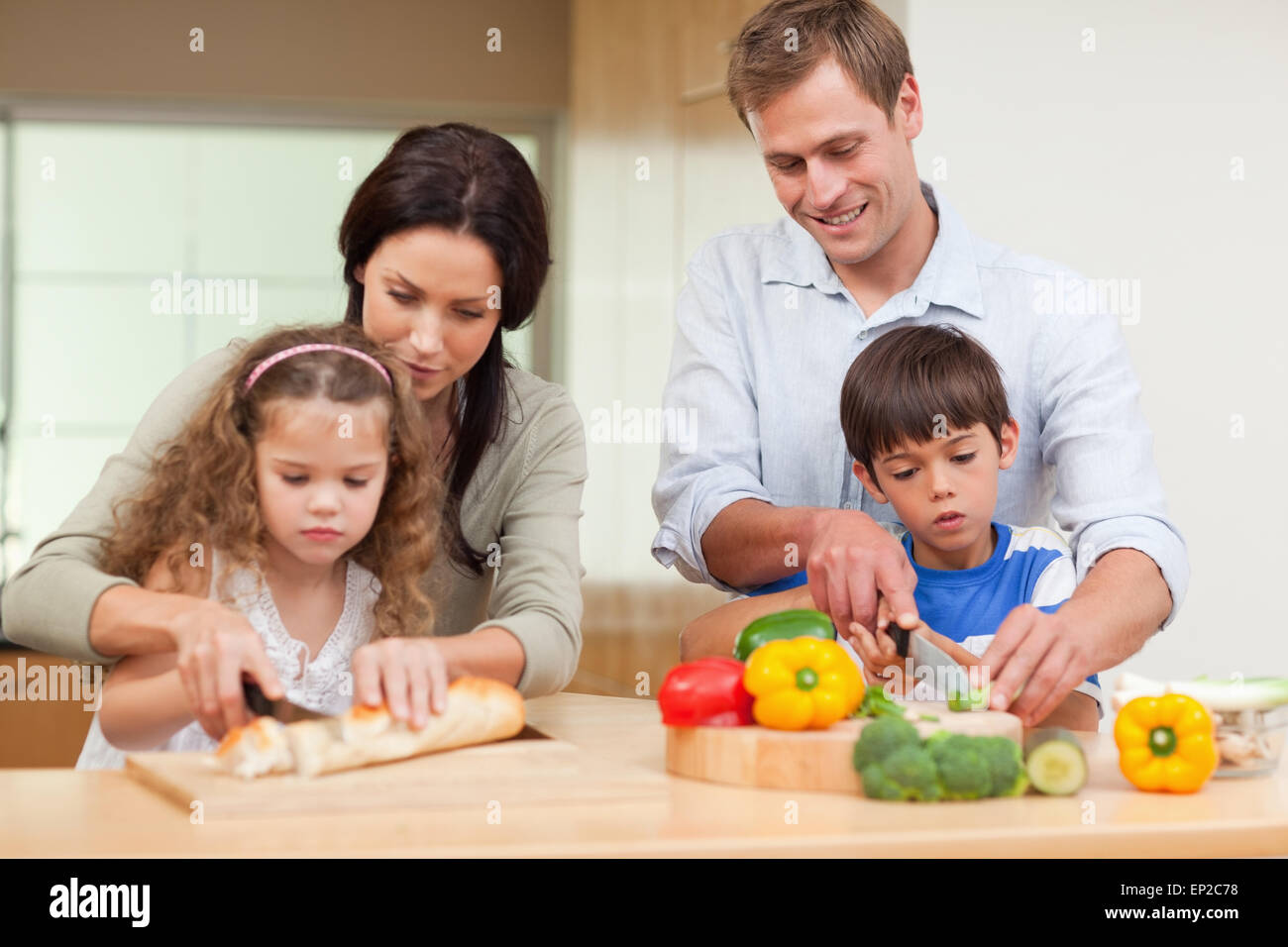 Family slicing ingredients Stock Photo - Alamy