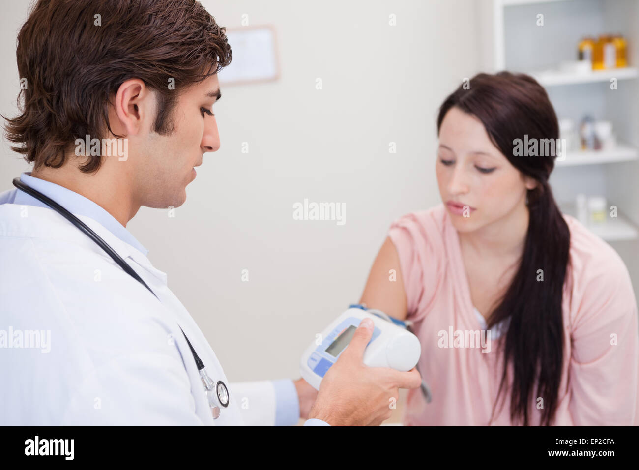 Patient having her blood pressure checked Stock Photo - Alamy