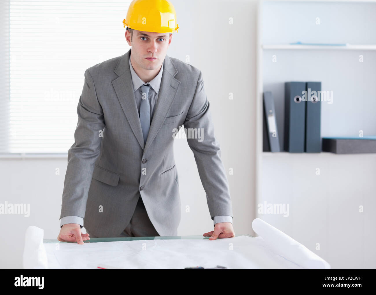Serious worker construction plans hi-res stock photography and images ...