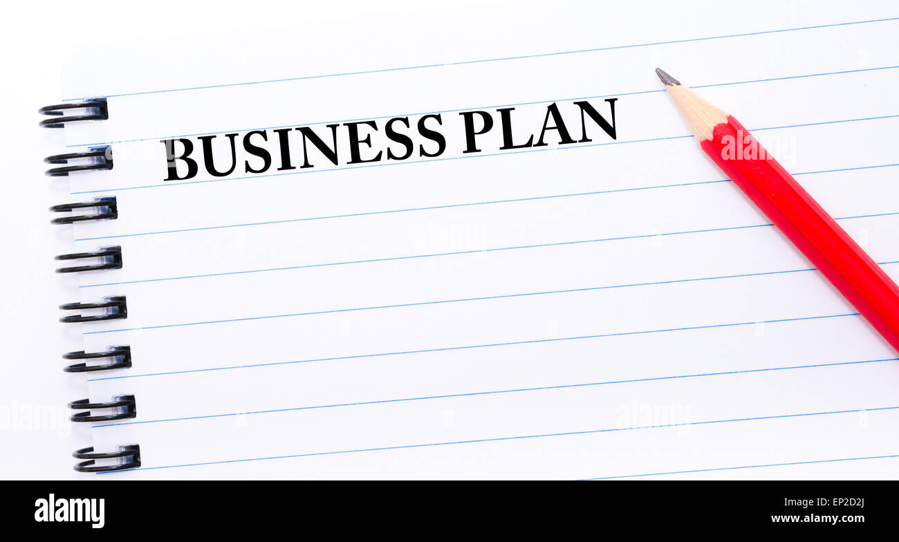 Business Plan Text written on notebook page, red pencil on the right ...