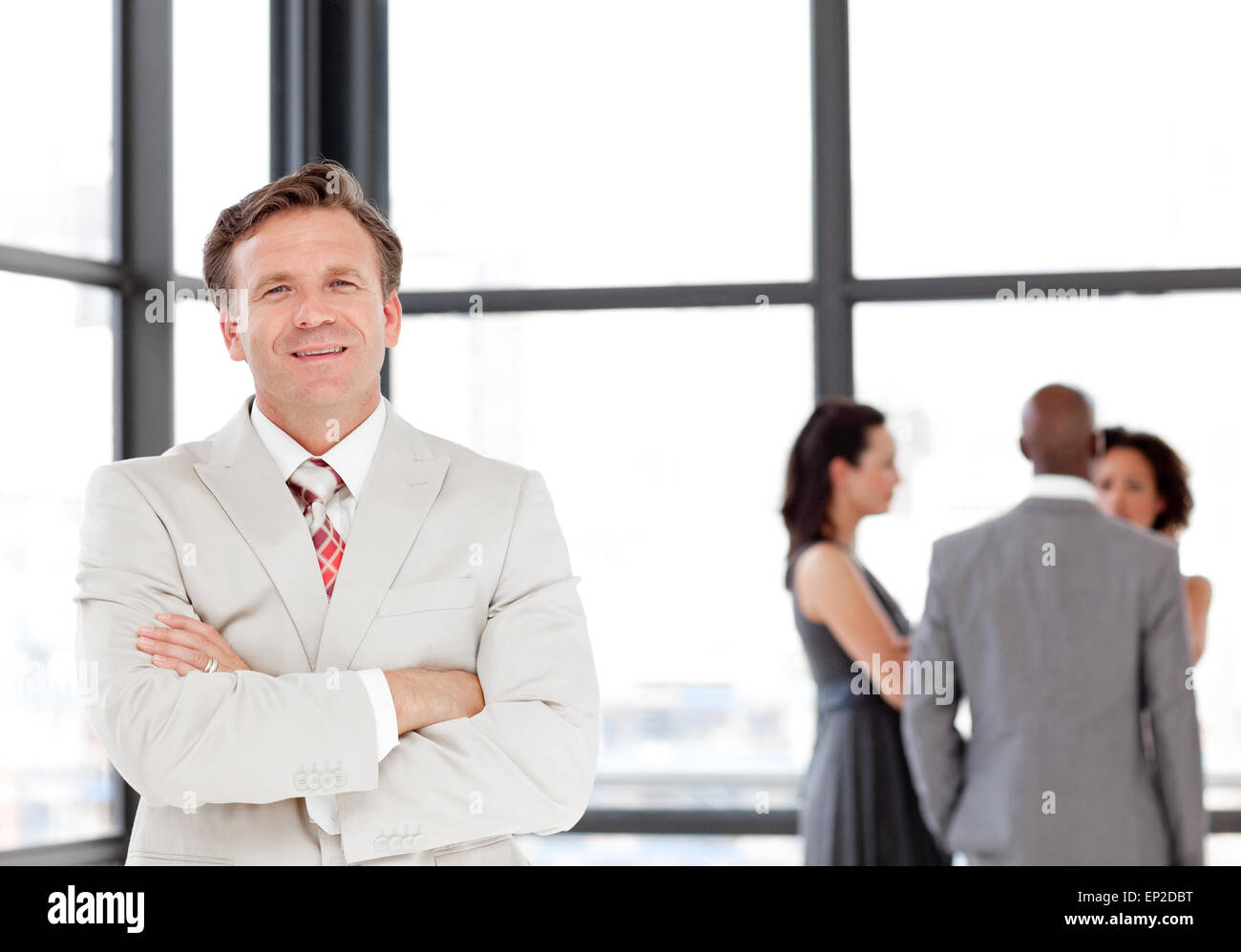 Serious male manager leading his team Stock Photo - Alamy
